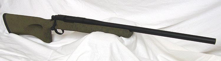 SC2TH in .260 Rem, black metal finish, olive & black stock.